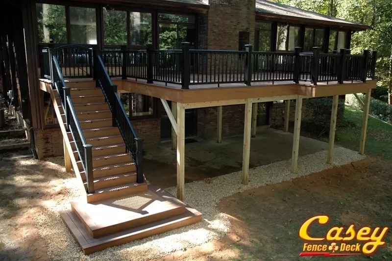 Stunning Harvest Bronze and Rustic Bark Deck with Staircase and Lighting